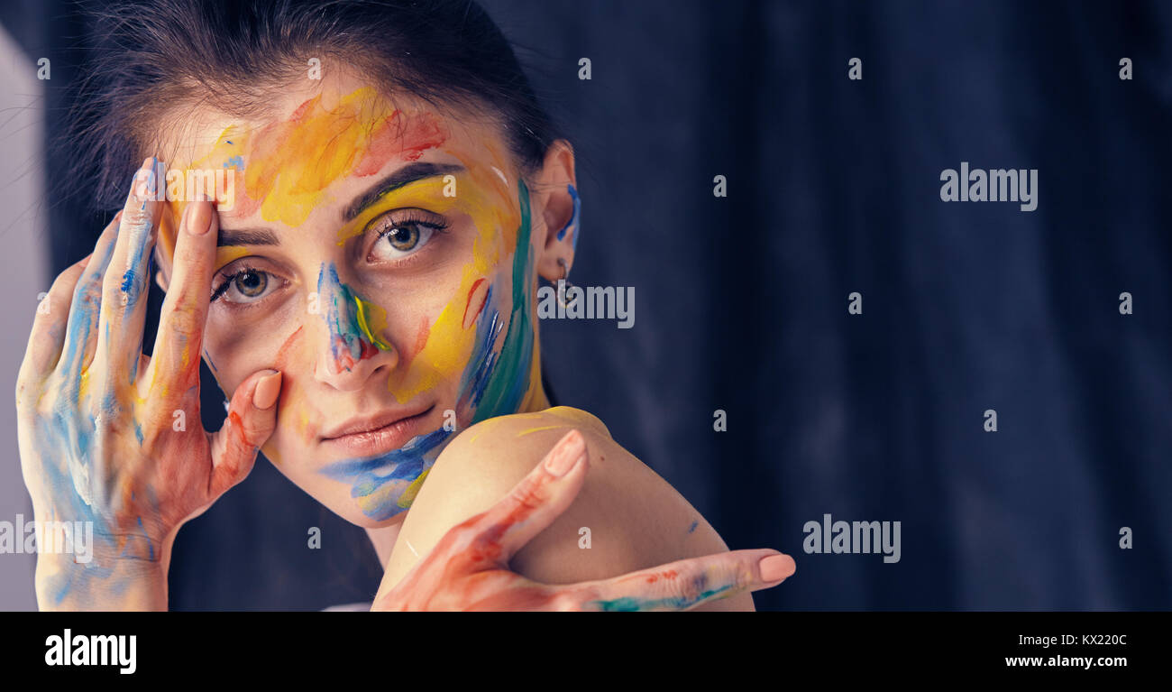beautiful woman painted with many vivid colors Stock Photo - Alamy