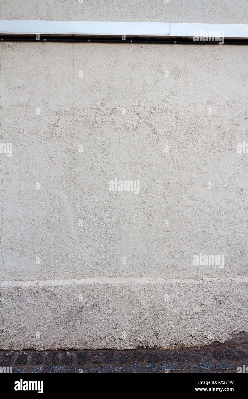 Old weathered white plaster wall and a ground Stock Photo - Alamy
