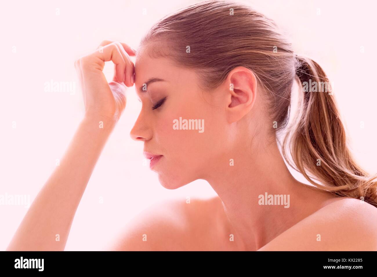 Person touching forehead hi-res stock photography and images - Alamy