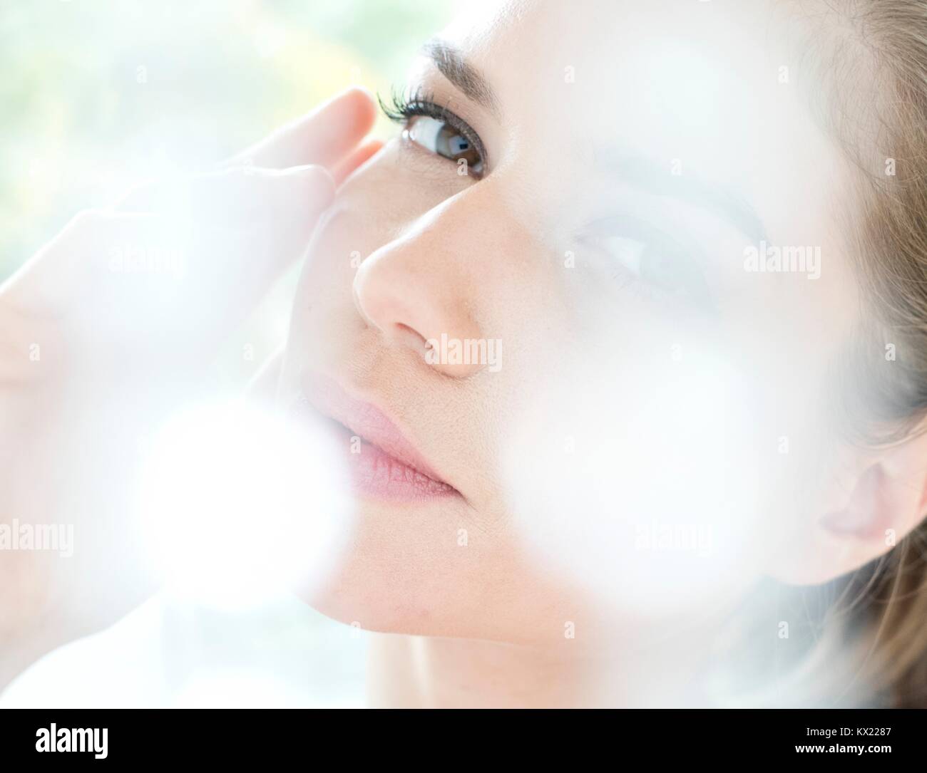 MODEL RELEASED. Young woman looking at camera, portrait Stock Photo - Alamy