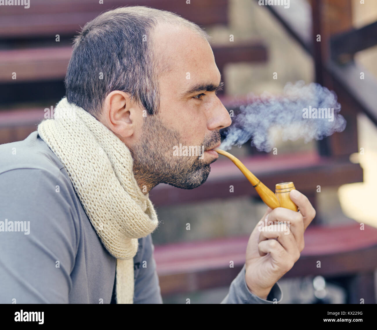 Man with a smoking pipe Stock Photo - Alamy