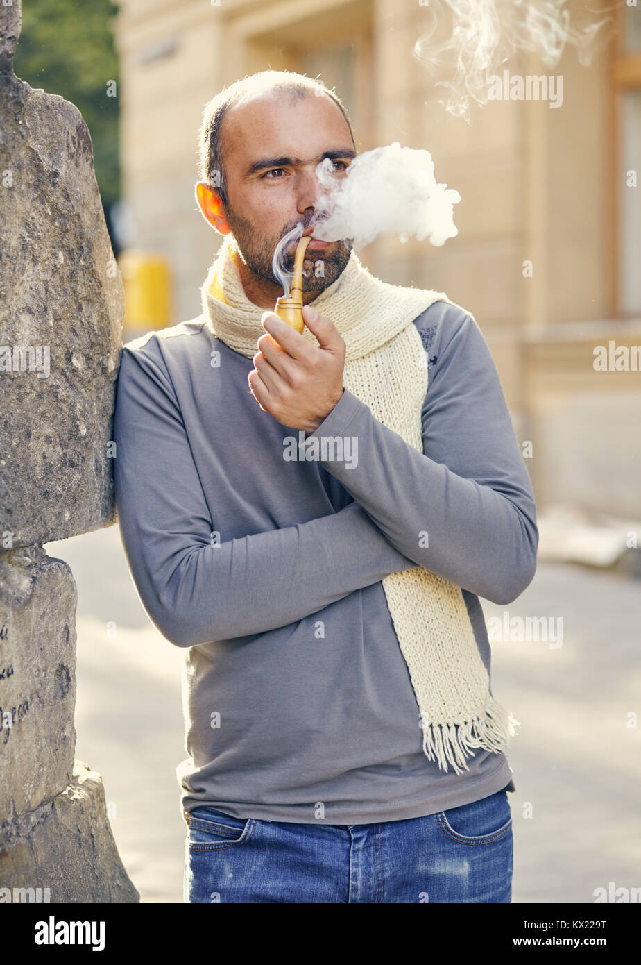 Man holding a pipe hi-res stock photography and images - Alamy