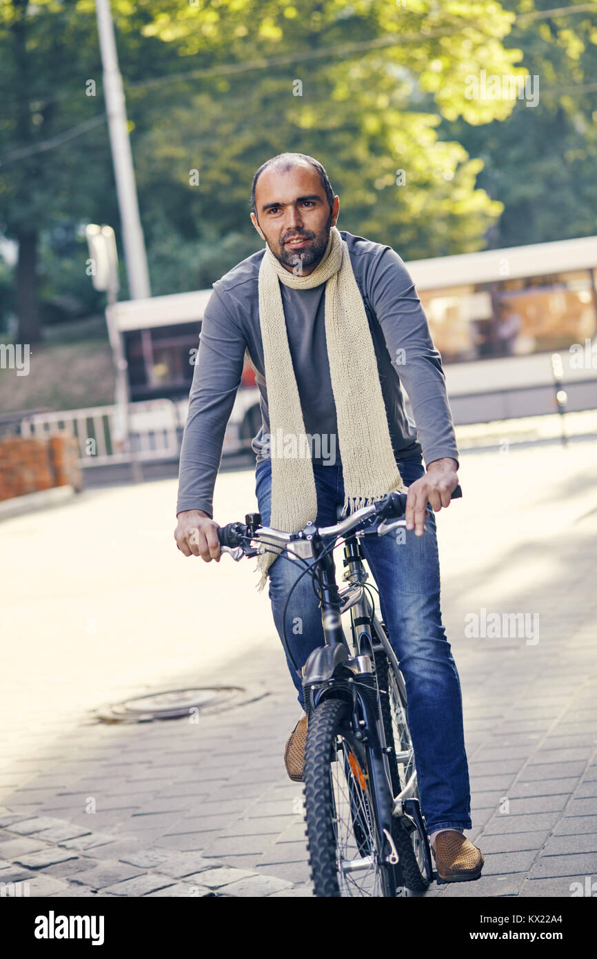 Man riding bike outdoors Stock Photo - Alamy
