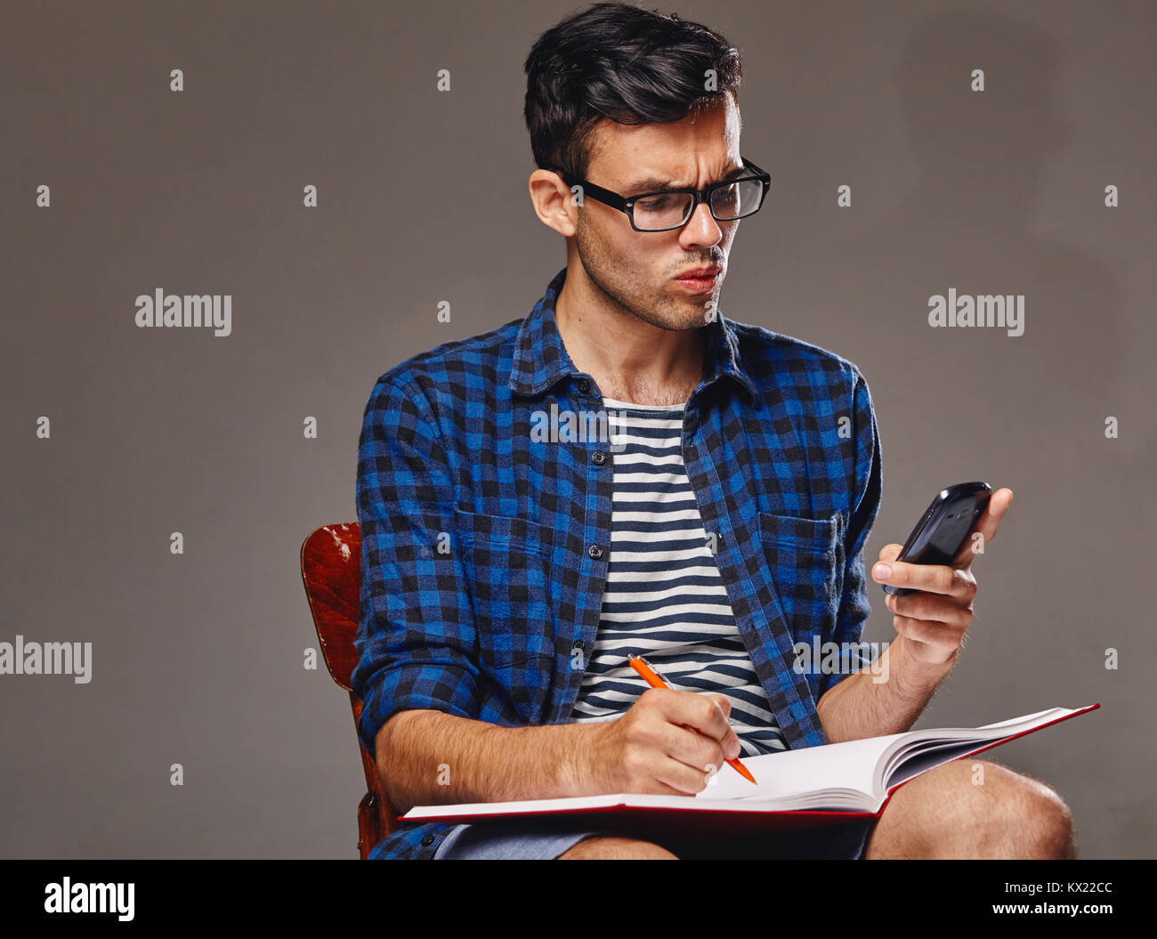 Young businesswoman reading something on hi-res stock photography and ...