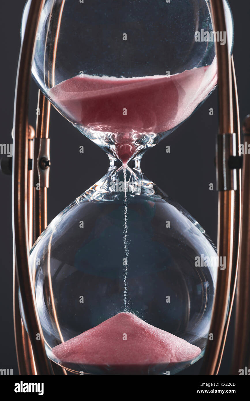 Hourglass with sand Stock Photo - Alamy