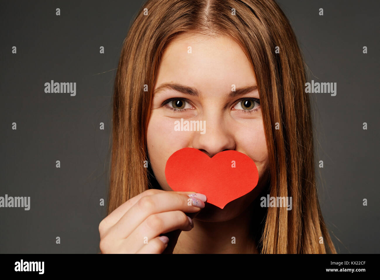 Lady with paper heart Stock Photo - Alamy