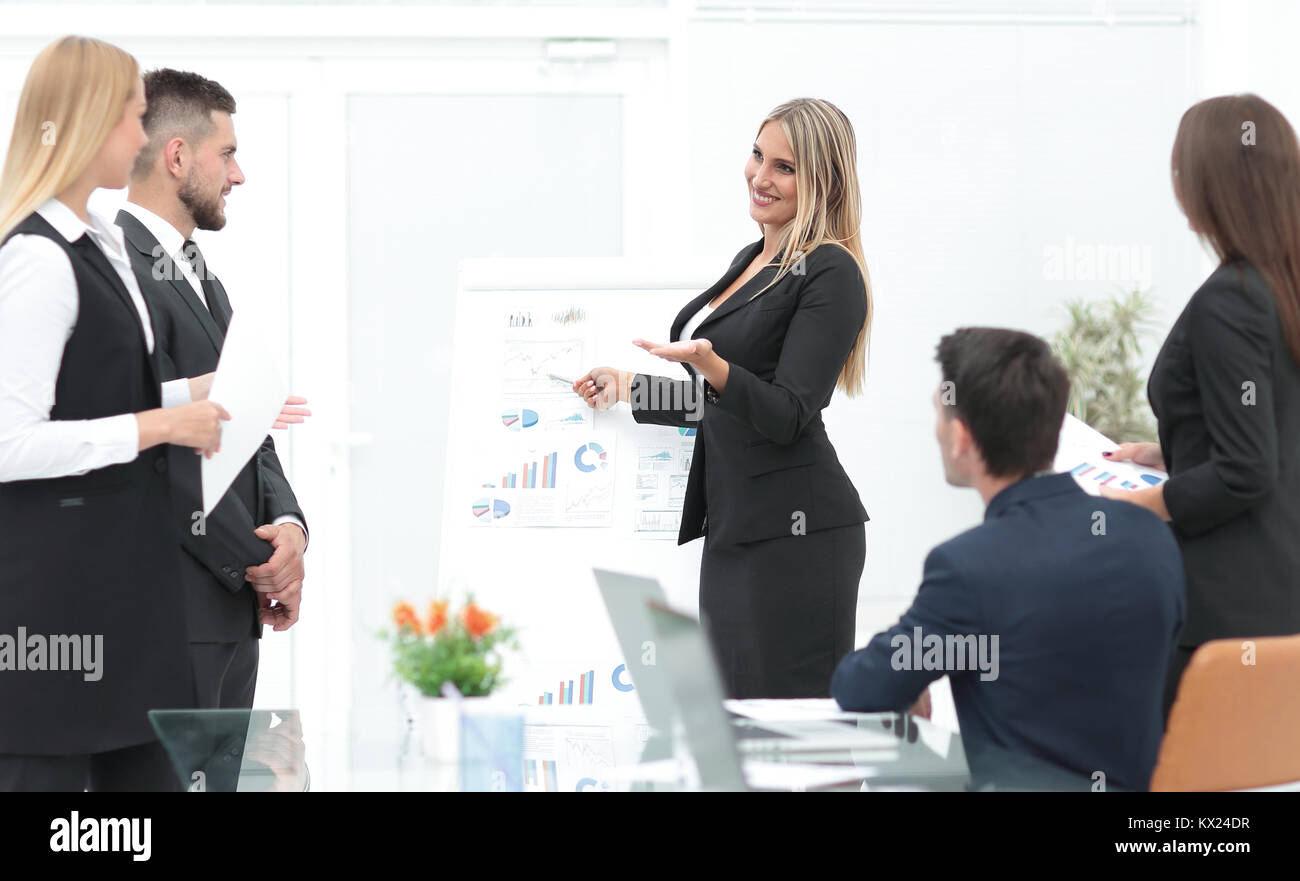 business woman doing a presentation to his business team.photo with ...