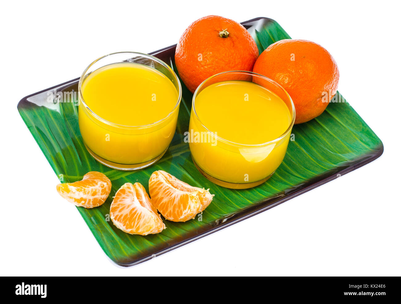 Green tray with fresh fruit juice Stock Photo - Alamy