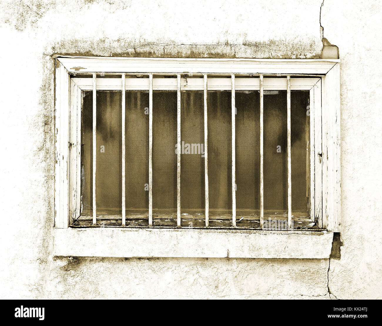 Run down exterior basement window in need of repair. Outer metal bars ...