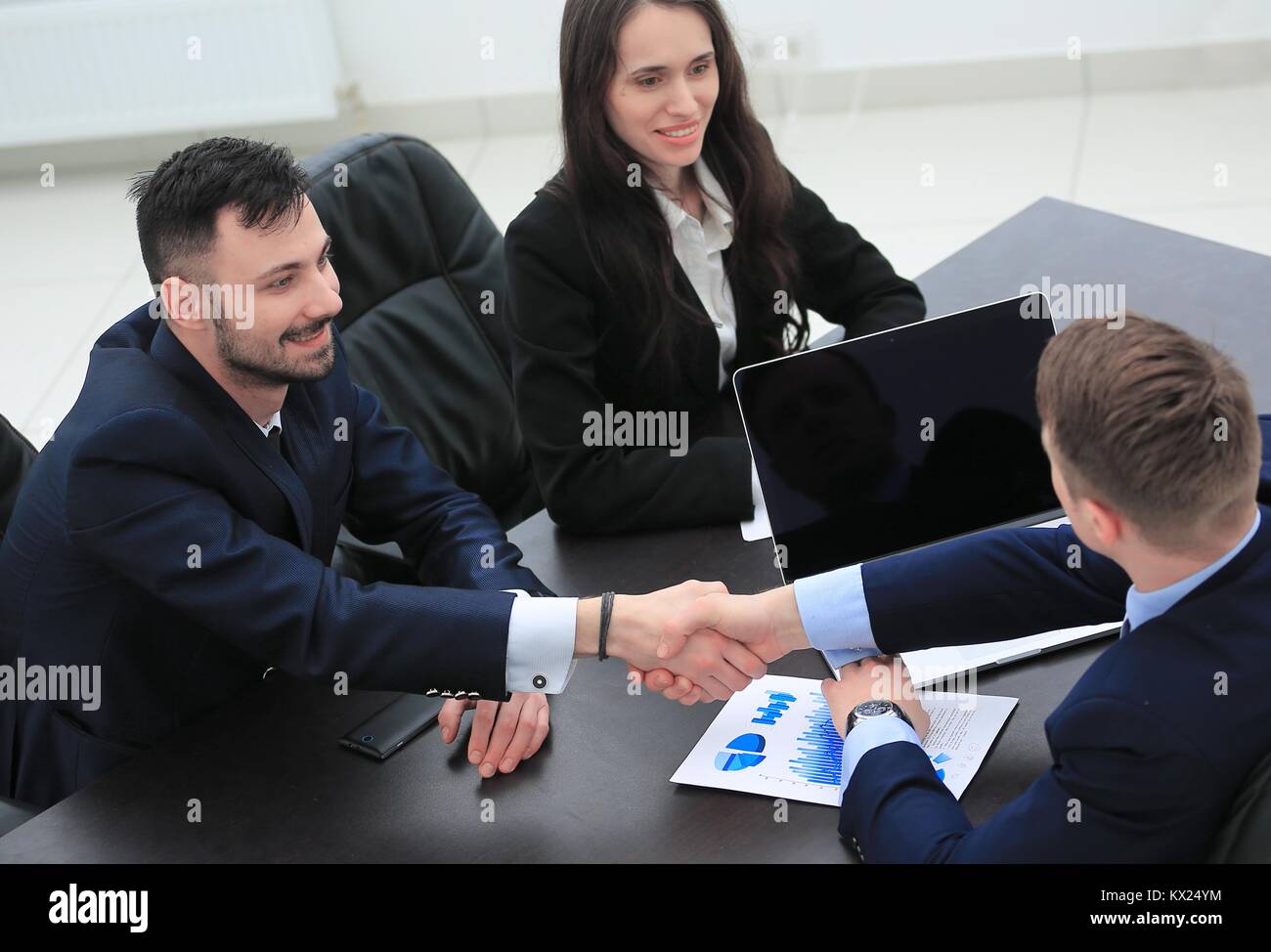 concept of cooperation and partnership. handshake financial partners ...