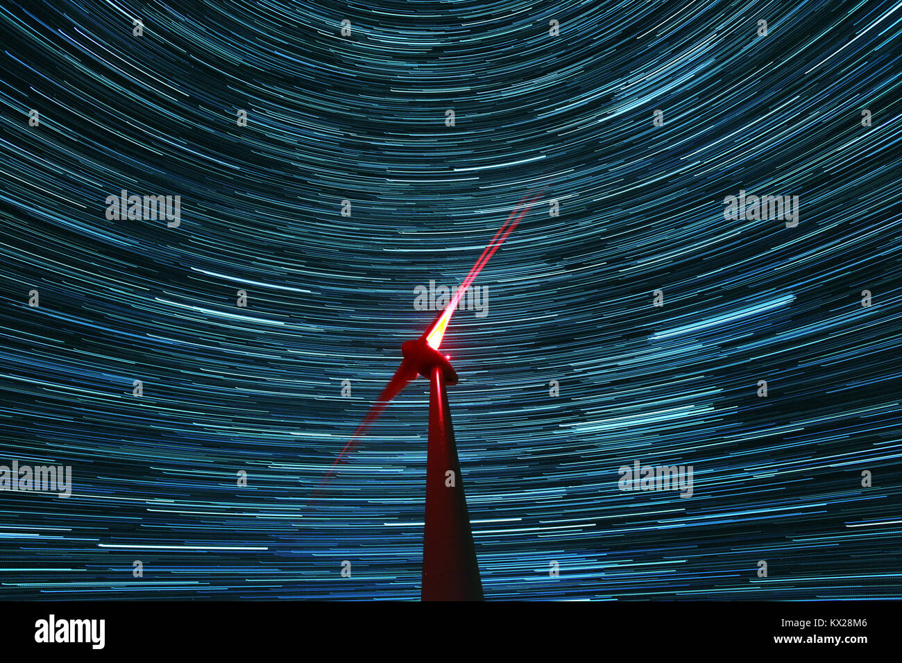 A wind turbine with a star trailed sky in the background Stock Photo ...