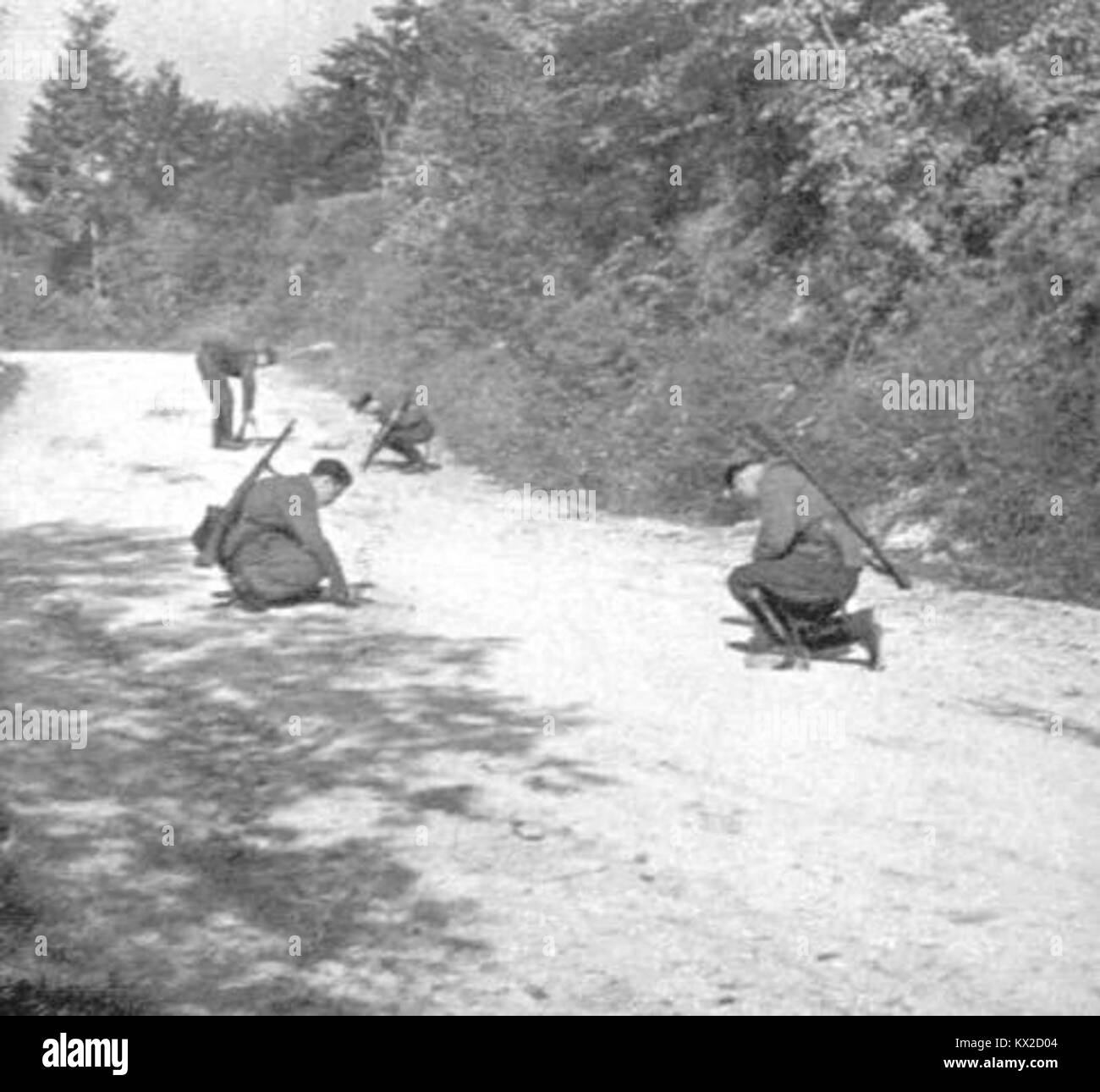 This image shows Domobranci (Home Guard) clearing mines on a road ...