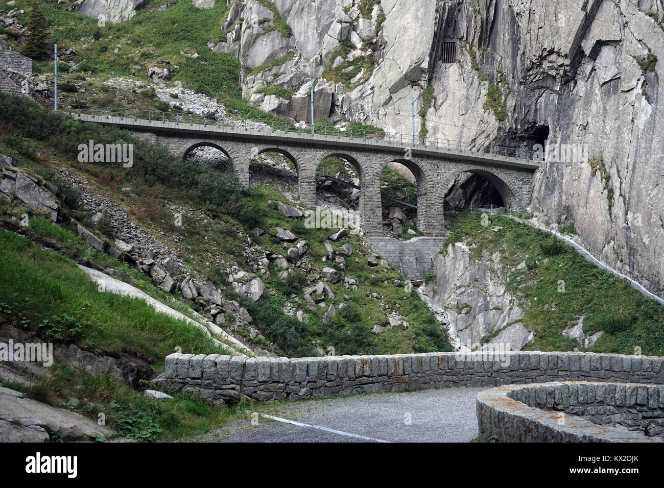 Railway bridge and slope near Andermatt in Switzerland Stock Photo - Alamy