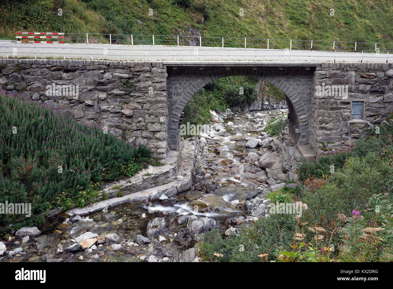 Stone bridge and road in Swiss Alps in Switzerland Stock Photo - Alamy