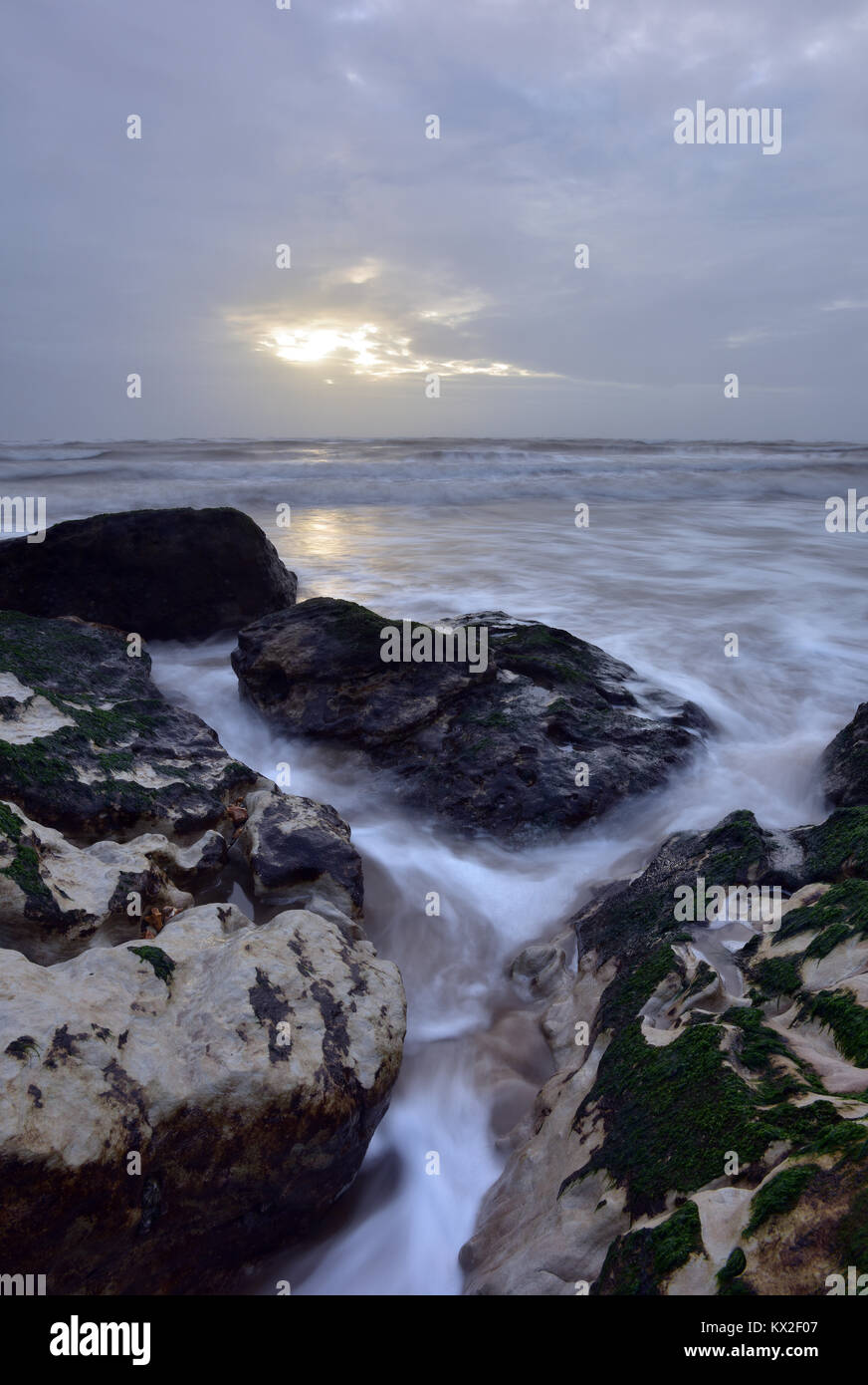 an atmospheric and stormy seascape of some rough and rocky Cornish ...