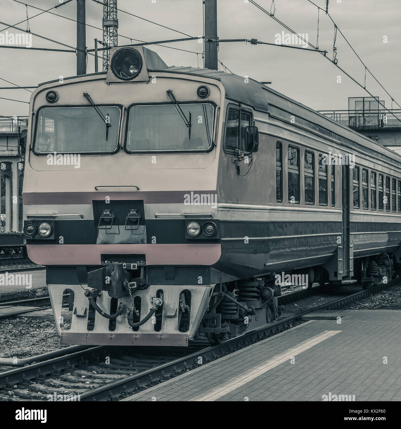 Old passenger diesel train moving at the terminal Stock Photo - Alamy