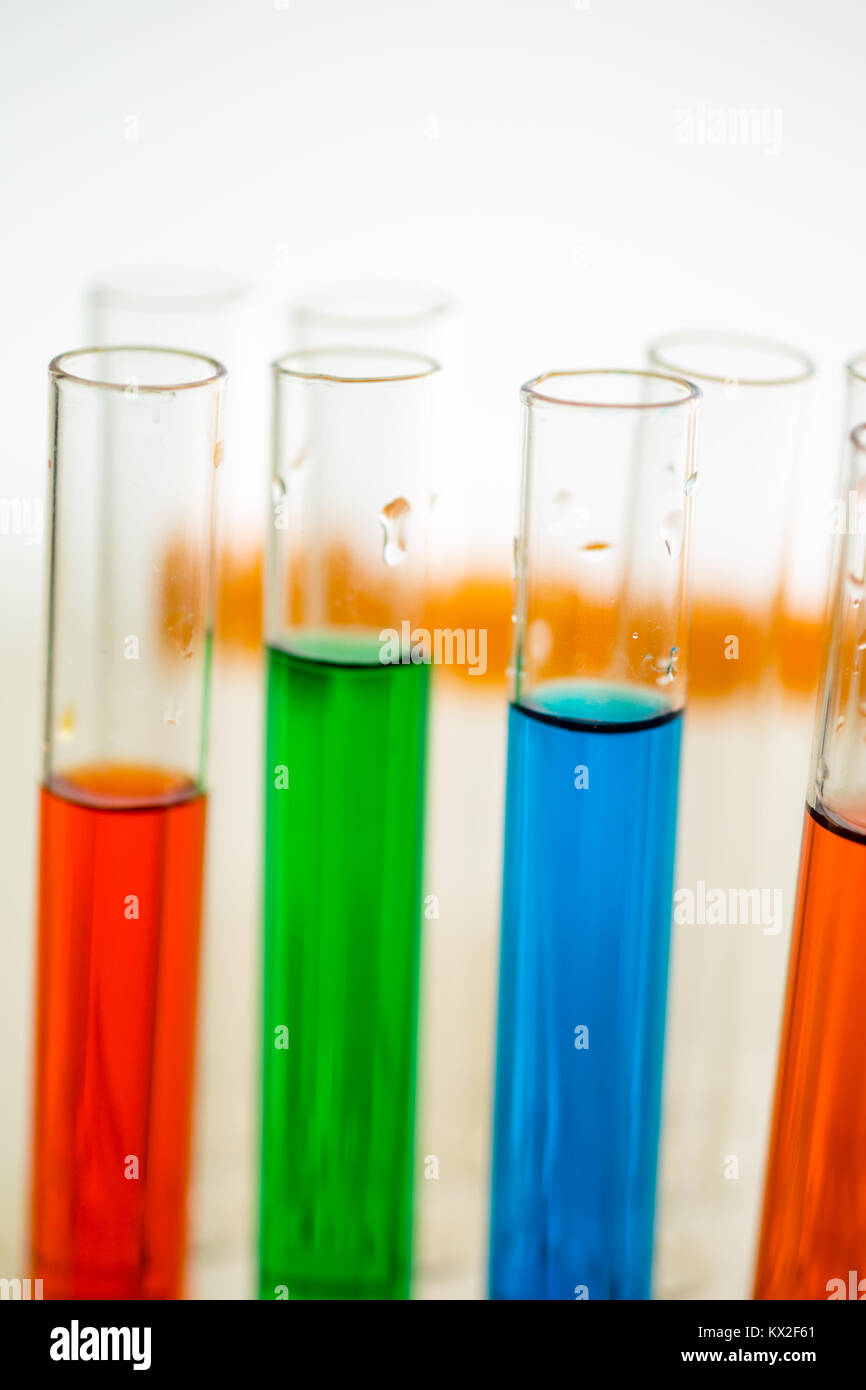 Rows of colorful test tubes on lab table Stock Photo - Alamy