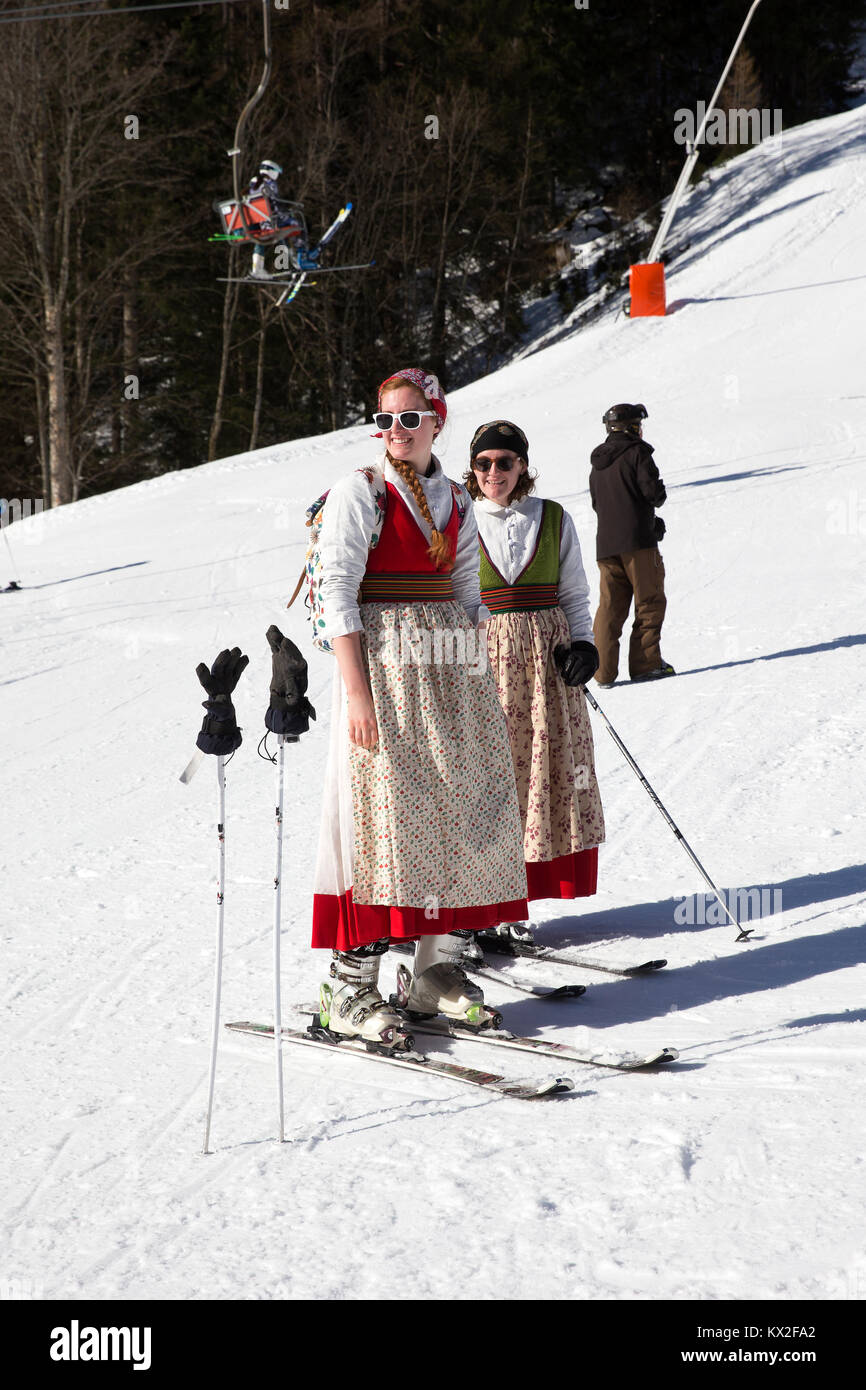 Italy Piedmont Val Formazza women in traditional costume on the snow ...