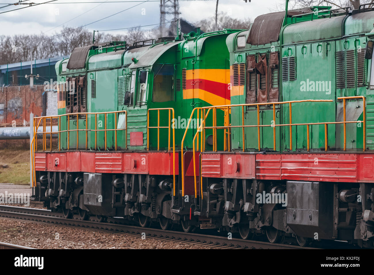 Green diesel cargo locomotive. Freight train in action Stock Photo - Alamy