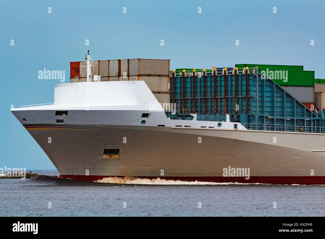 Grey container ship. Logistics and production import Stock Photo - Alamy