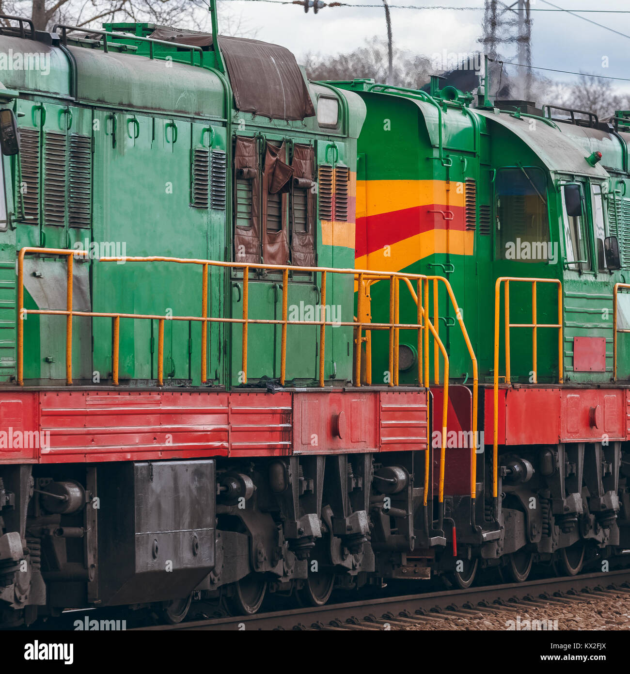 Green diesel cargo locomotive. Freight train in action Stock Photo - Alamy