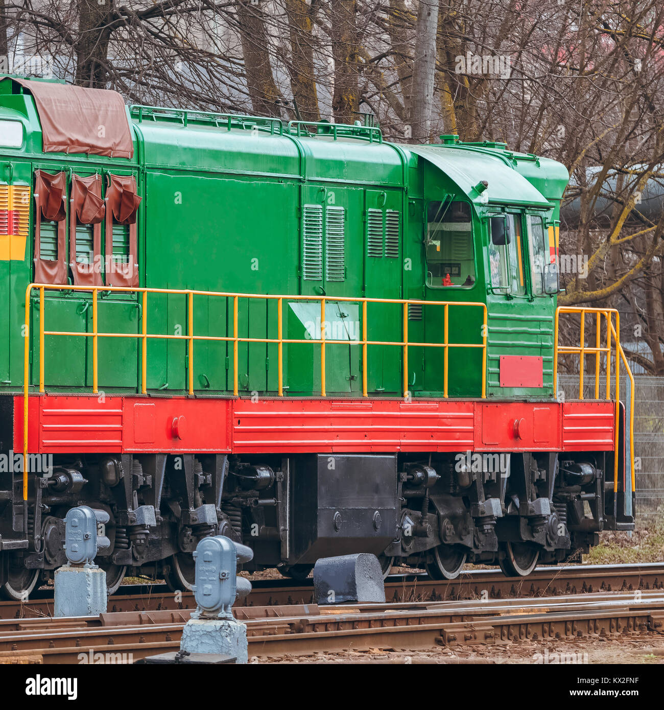 Green diesel cargo locomotive. Freight train in action Stock Photo - Alamy