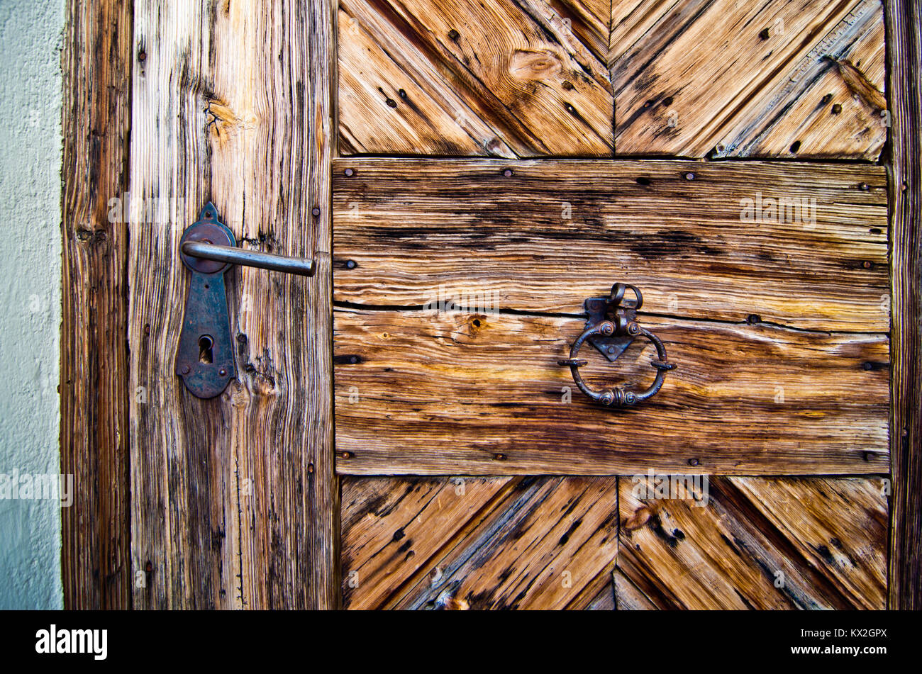 locking mechanism and knocker in burnished metal of an ancient wooden ...