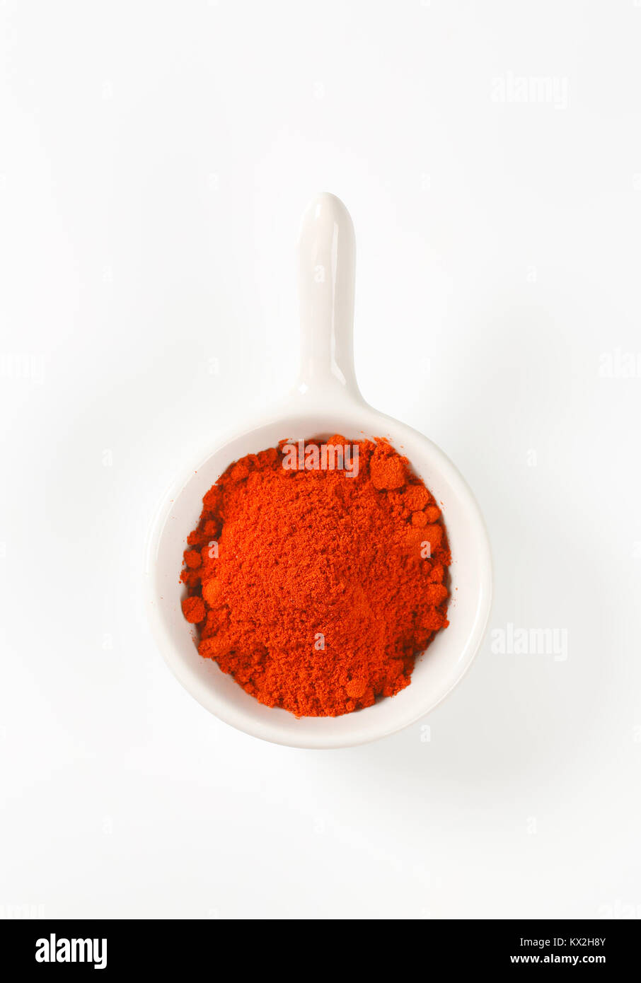 Ground Red Pepper in small white dish Stock Photo - Alamy