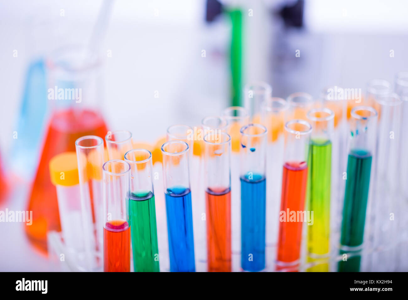 Test tubes, microscope, and beakers on lab table Stock Photo - Alamy