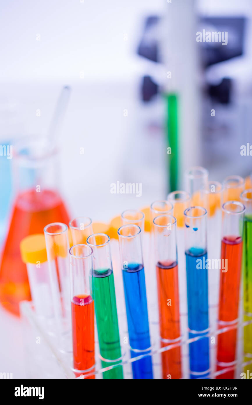 Test tubes, microscope, and beakers on lab table Stock Photo - Alamy