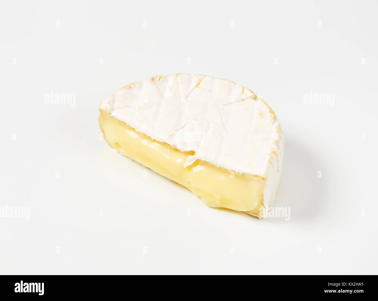 half a wheel of soft-ripened cheese with white rind Stock Photo - Alamy