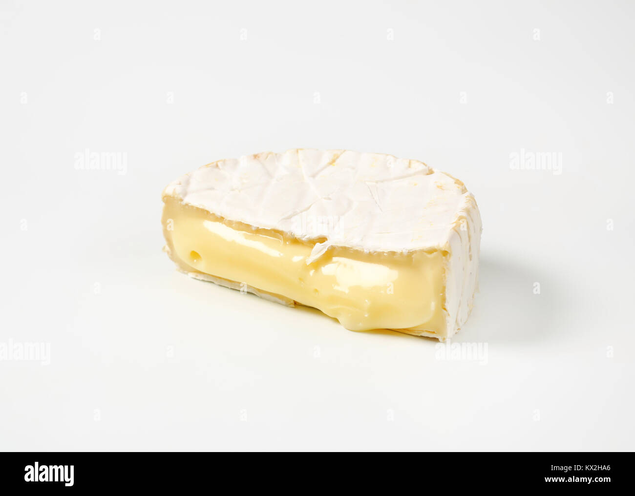 half a wheel of soft-ripened cheese with white rind Stock Photo - Alamy