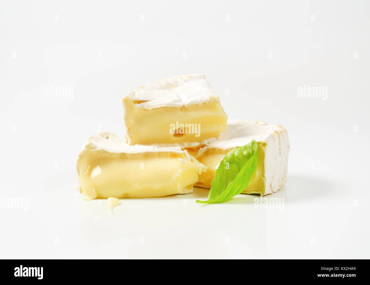 pieces of soft-ripened cheese with white rind Stock Photo - Alamy