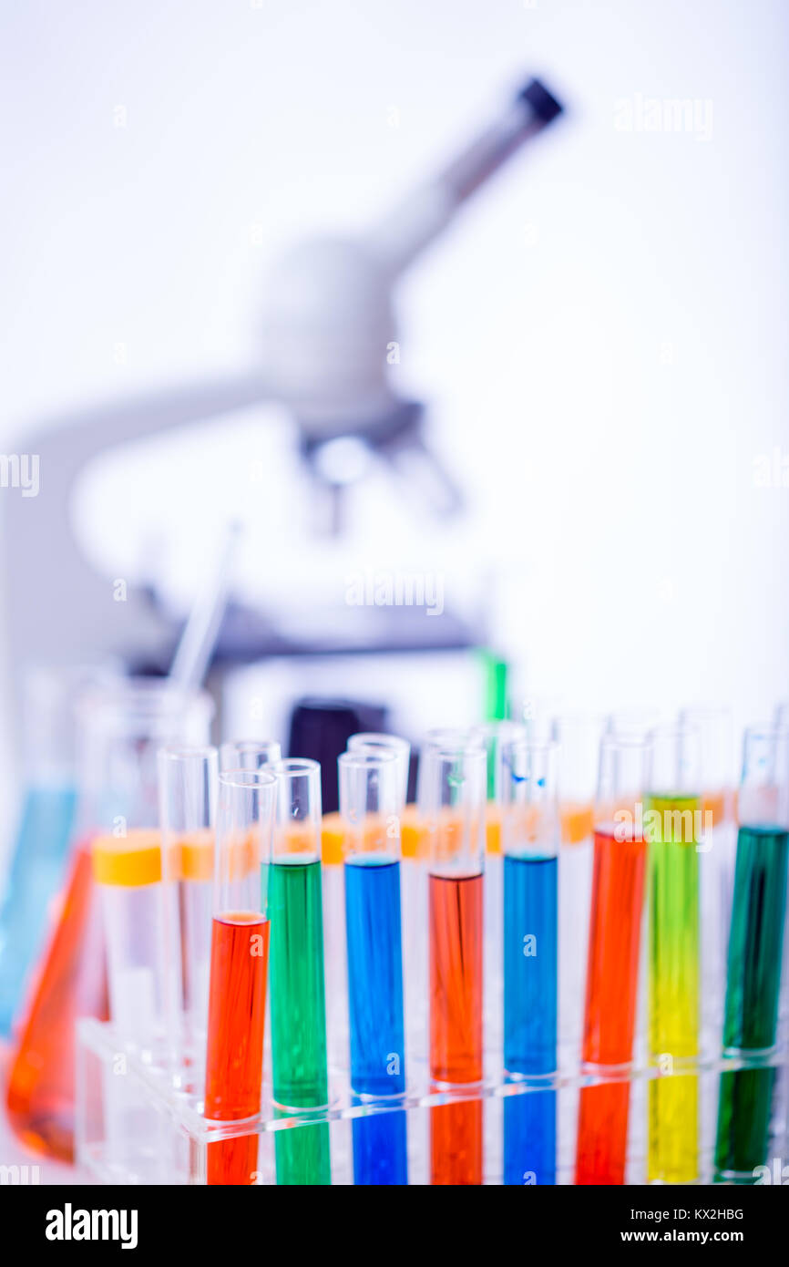 Test tubes, microscope, and beakers on lab table Stock Photo - Alamy
