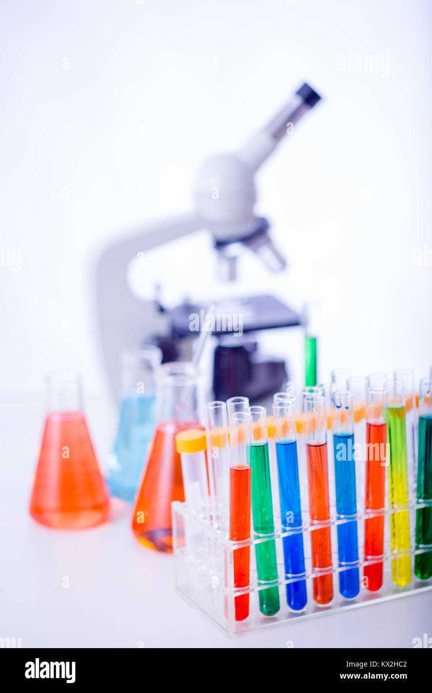 Test tubes, microscope, and beakers on lab table Stock Photo - Alamy