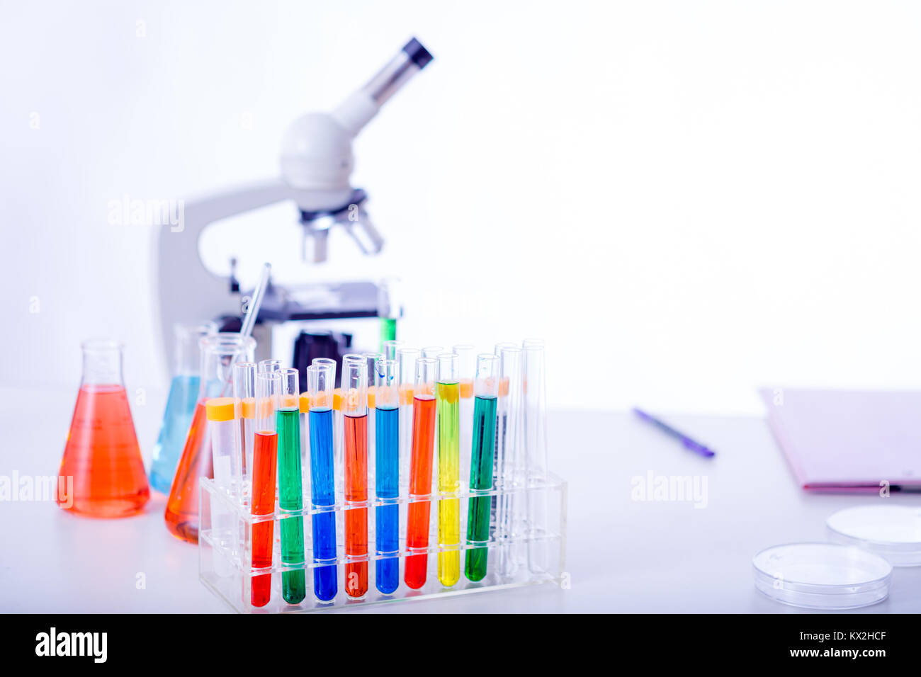 Test tubes, microscope, and beakers on lab table Stock Photo - Alamy