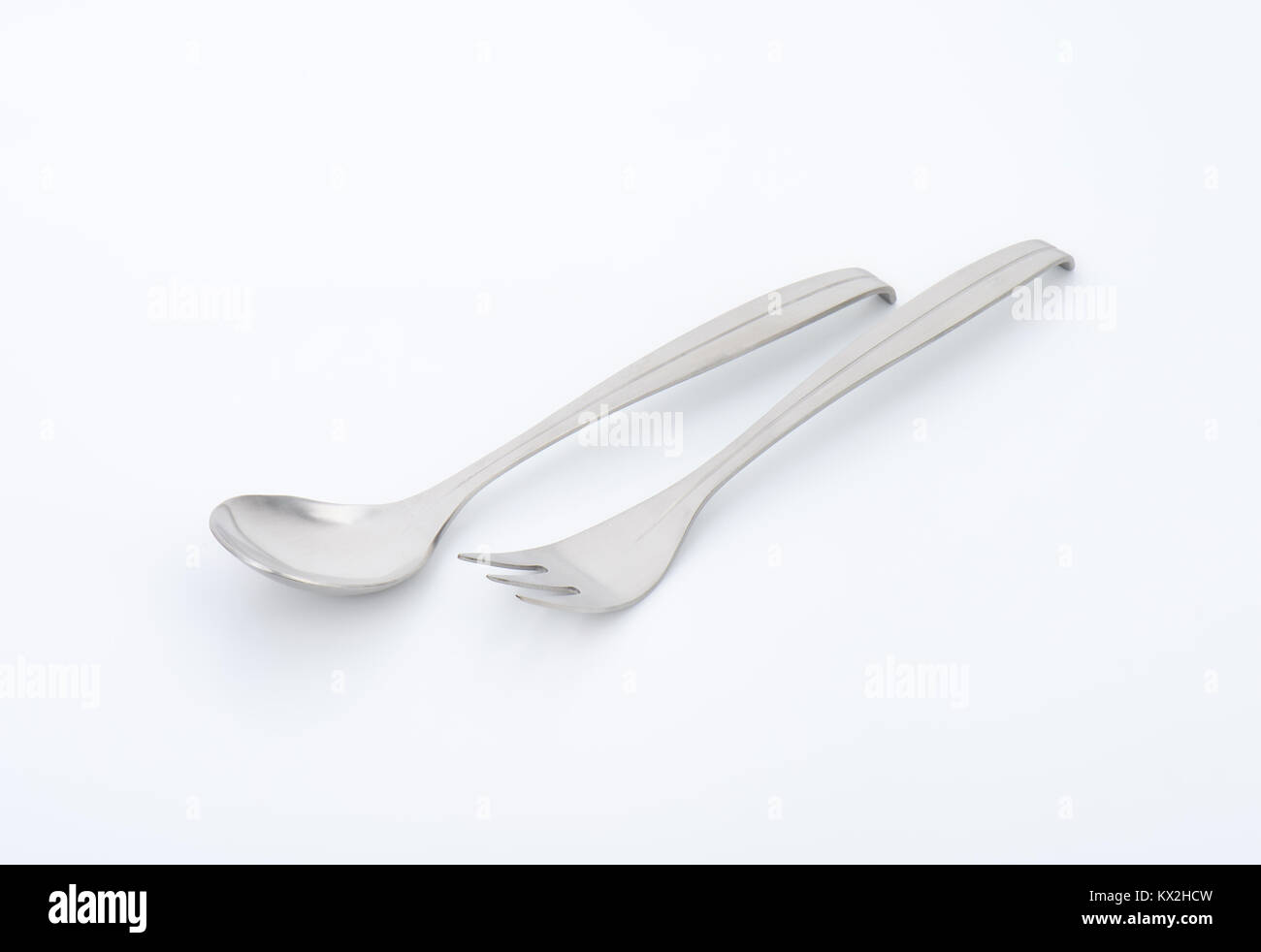 Metal spoon and three-pronged fork Stock Photo - Alamy