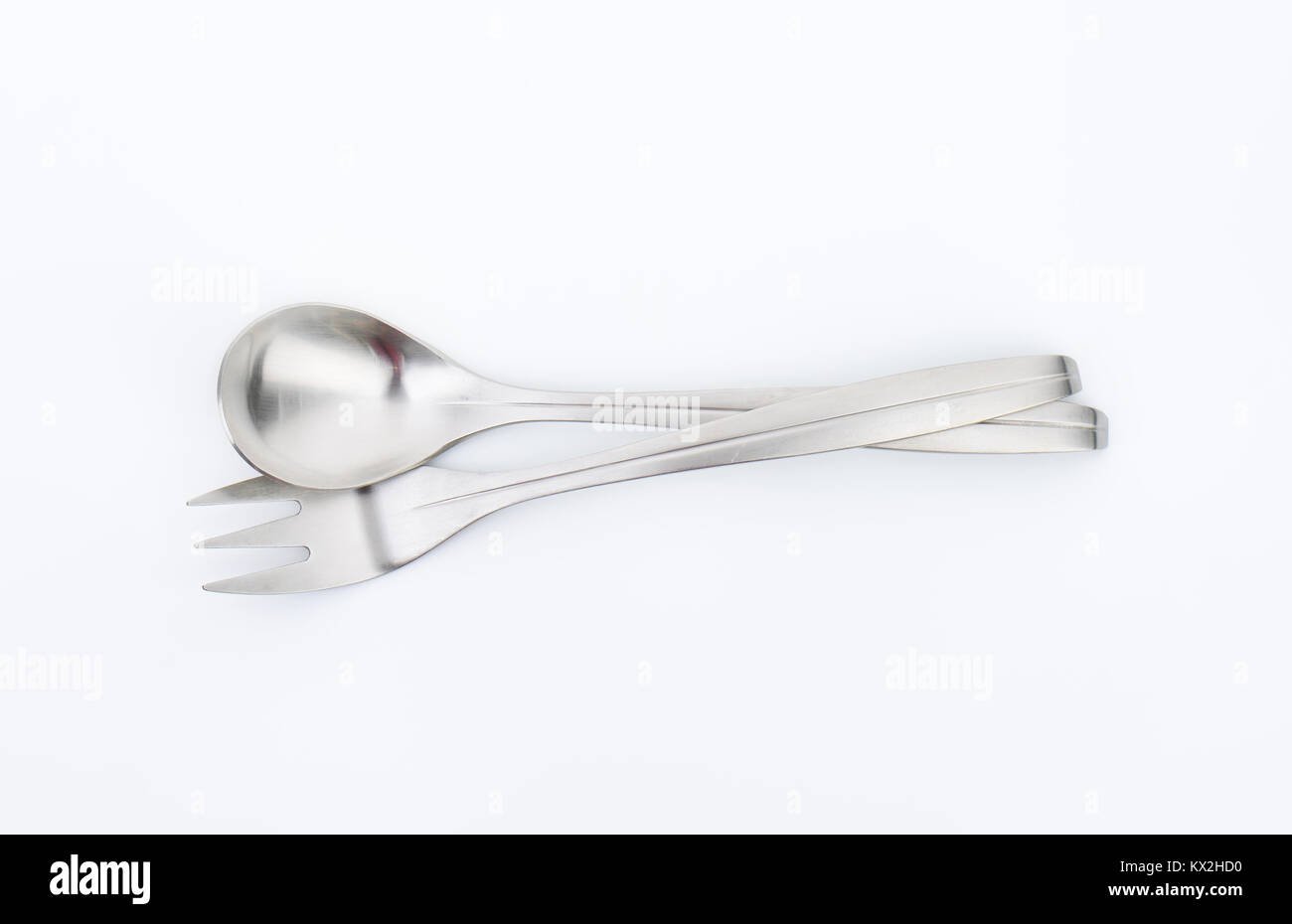 Metal spoon and three-pronged fork Stock Photo - Alamy