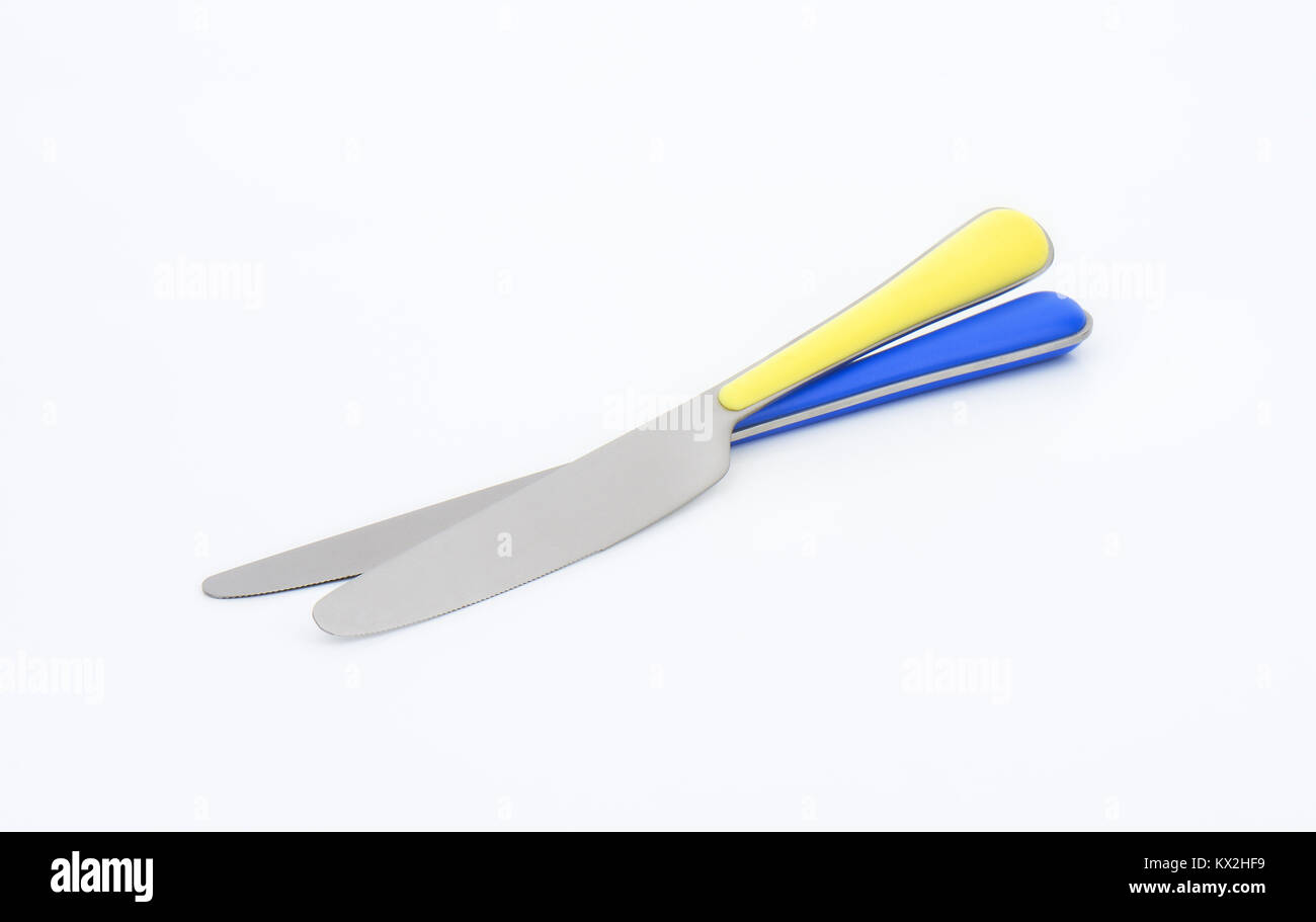 Two table knives, one with blue handle, the other one with yellow ...