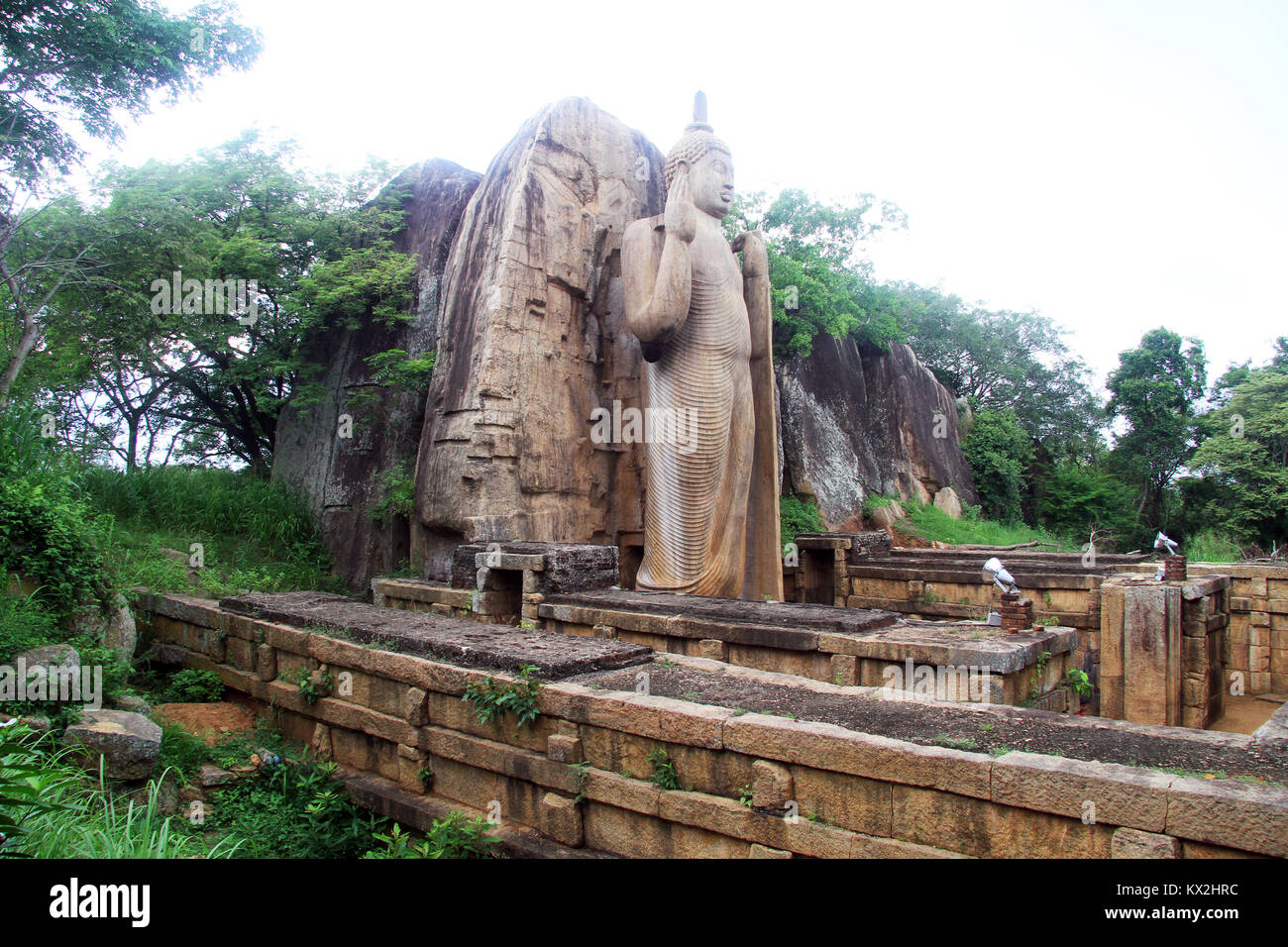 Aukana buddha and ruins of temple in Sri Lanka Stock Photo - Alamy