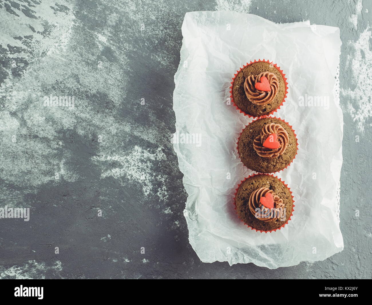 Fresh cupcakes decorated with cream and hearts Stock Photo - Alamy