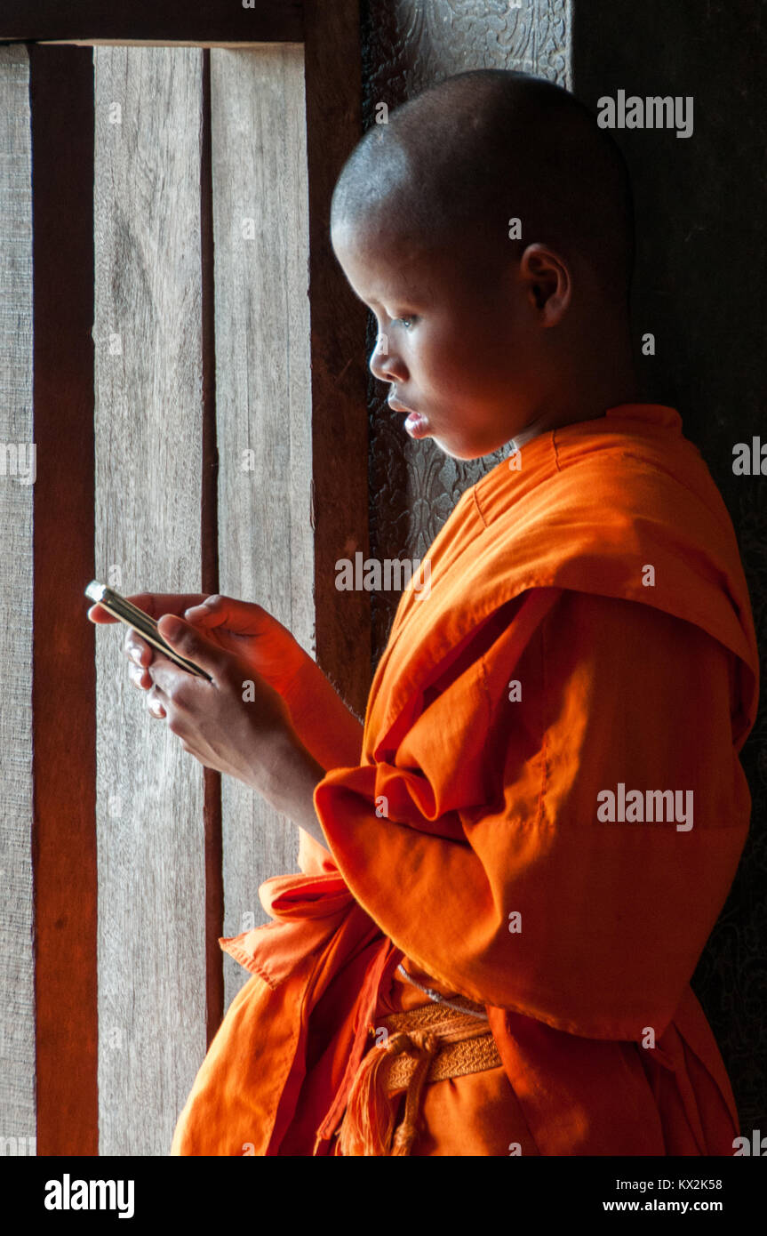 Monks cell phone hi-res stock photography and images - Alamy