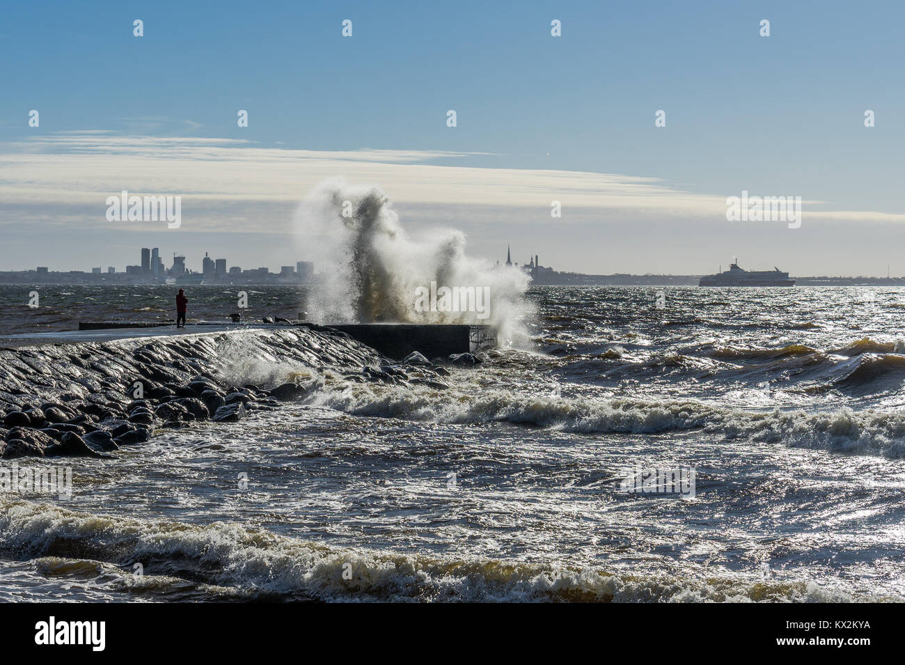 Storm on sea. Estonian capital Tallinn at background, with people Stock ...