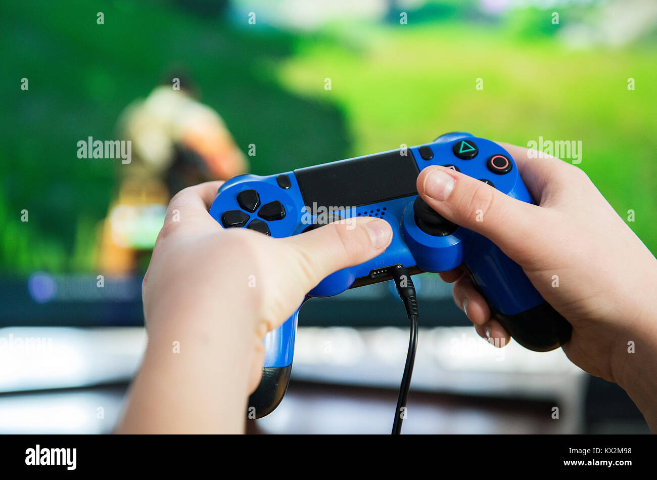 A young boy plays on a gaming console Stock Photo - Alamy