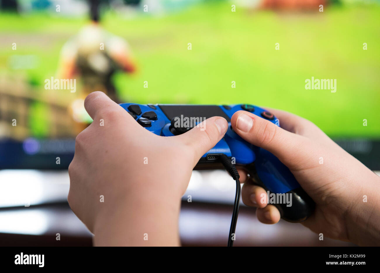 A young boy plays on a gaming console Stock Photo - Alamy