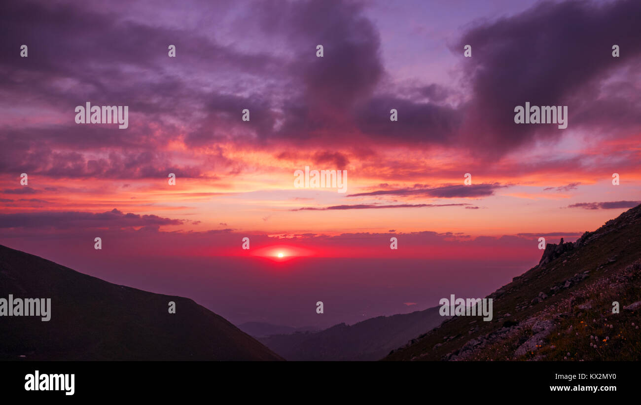 Mountain ridges and a majestic sunset ar the summer season Stock Photo ...