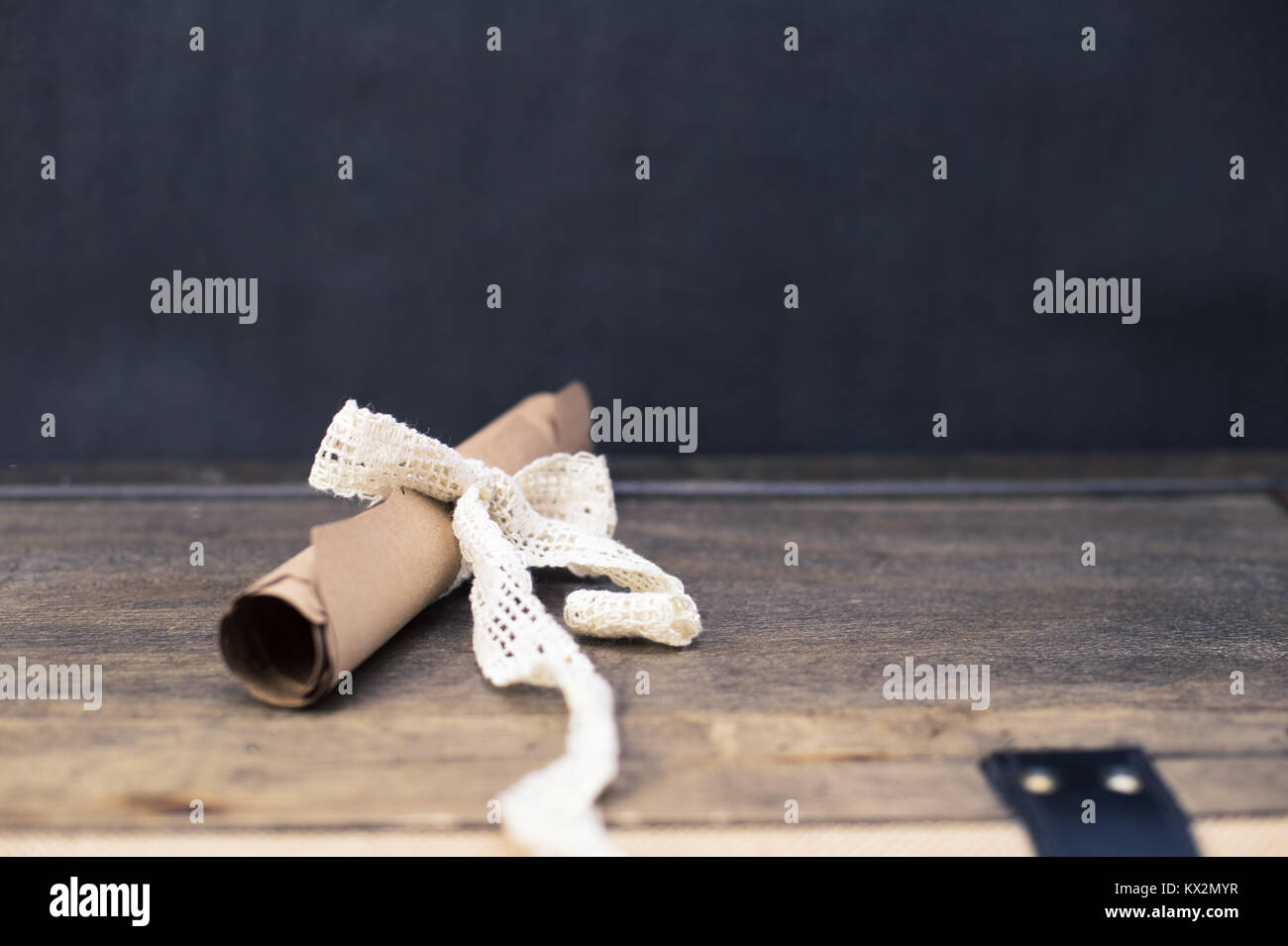Scrolled brown papyrus with a beautiful ribbon for valentine message ...