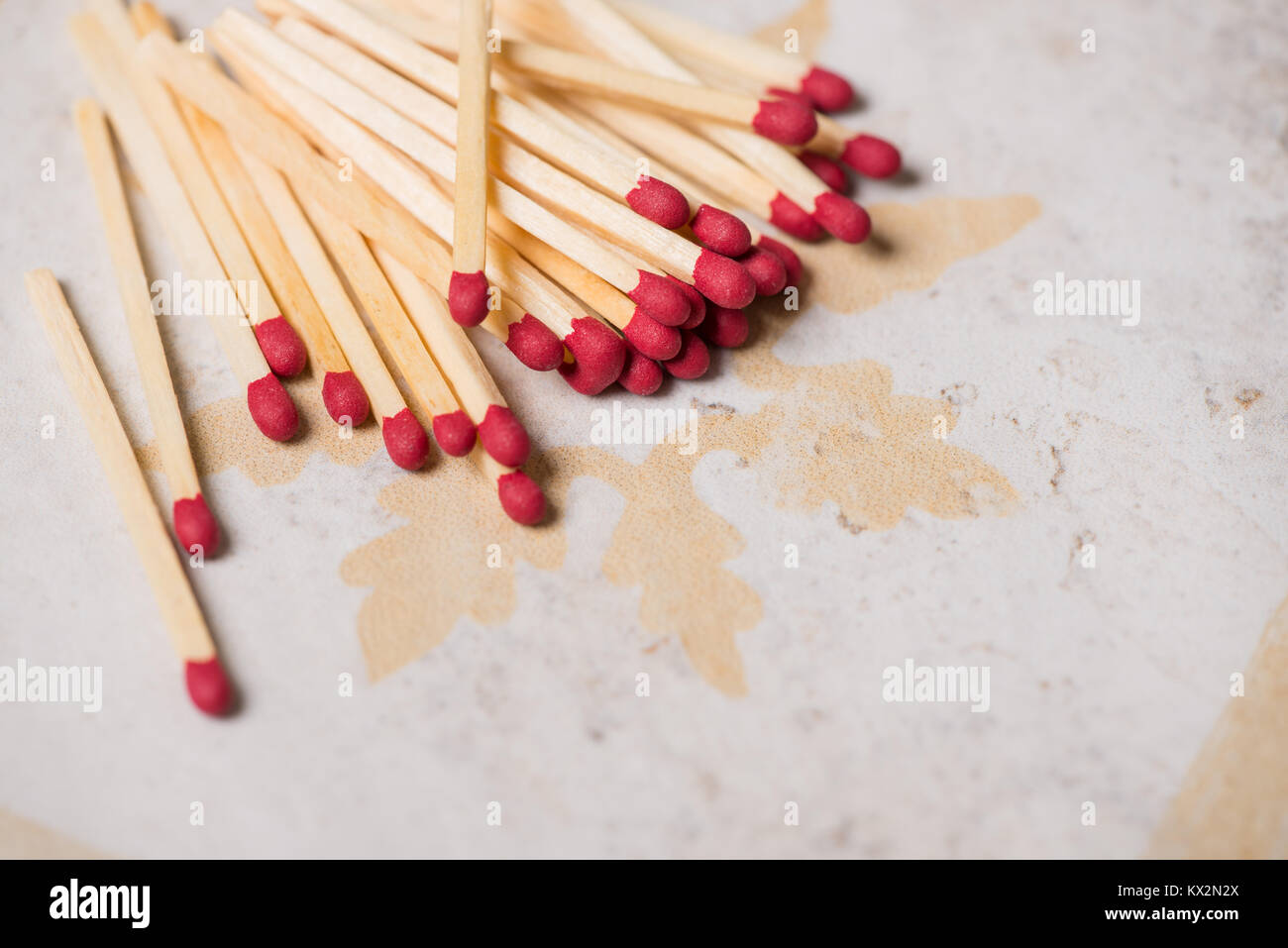Matches on tile or ceramic background with copy space Stock Photo - Alamy