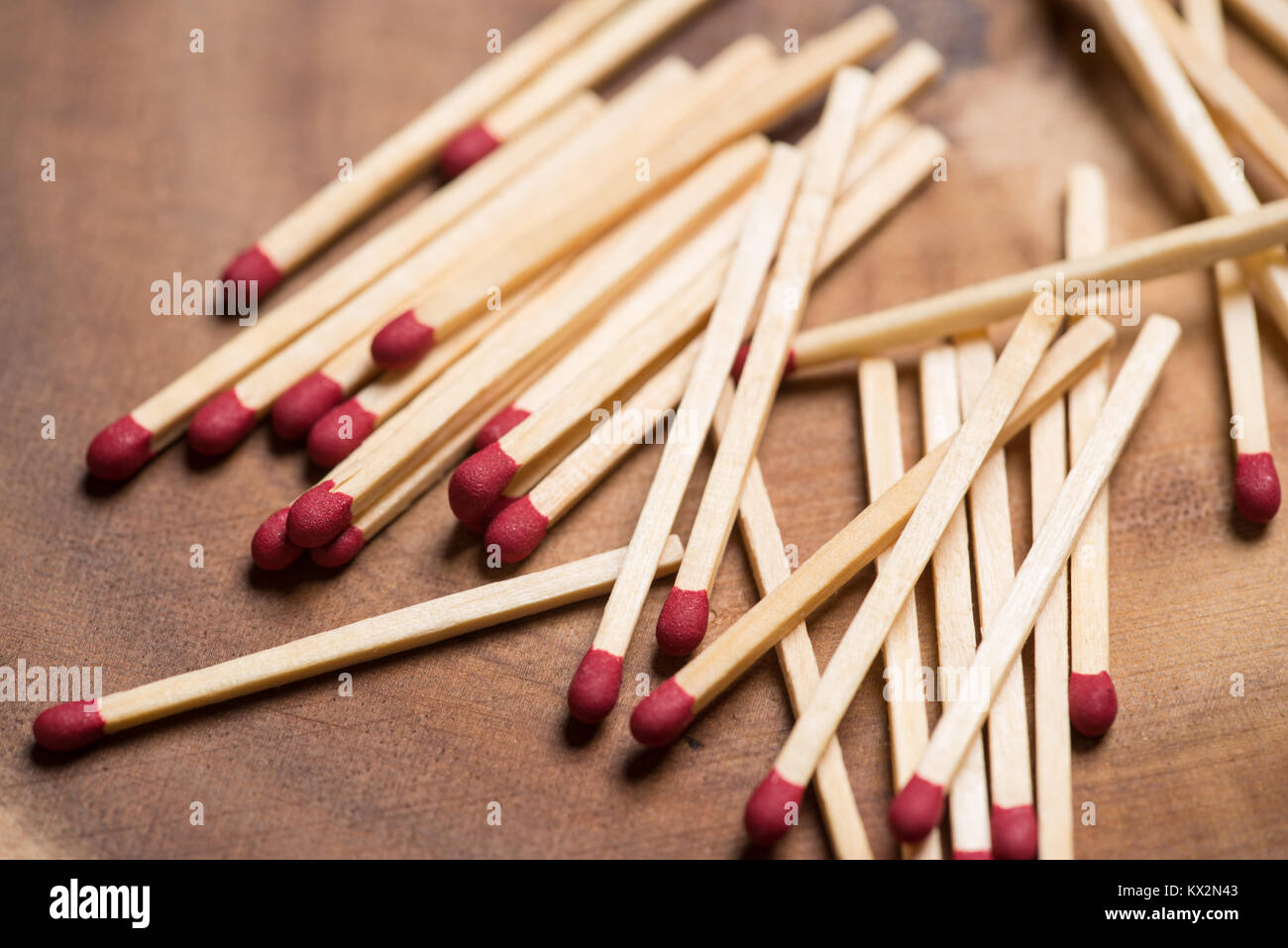 Matches on wooden table background Stock Photo - Alamy