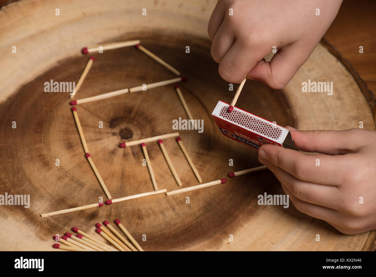 Child with match stick hi-res stock photography and images - Alamy